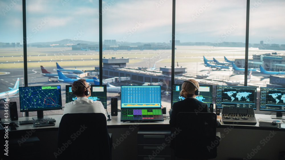 Diverse Air Traffic Control Team Working in a Modern Airport Tower ...