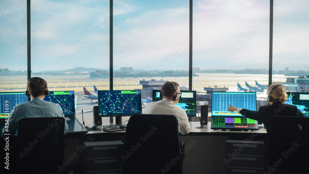 Diverse Air Traffic Control Team Working in a Modern Airport Tower ...