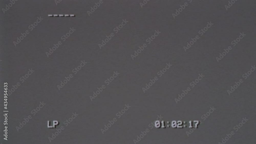 VHS. An old bad VHS tape playing. Old gray screen with timecode. VHS ...