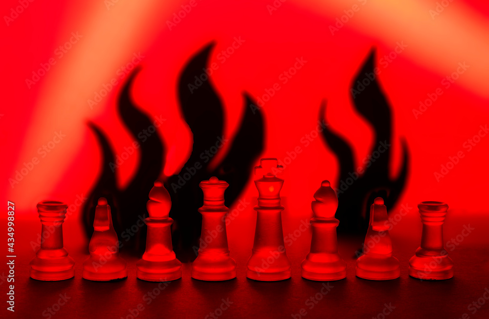 Red chess pieces with black flames and red background ready for the ...