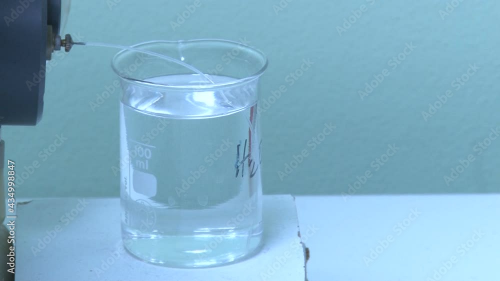 Video „water in a beaker. water in a glass beaker on a white background ...