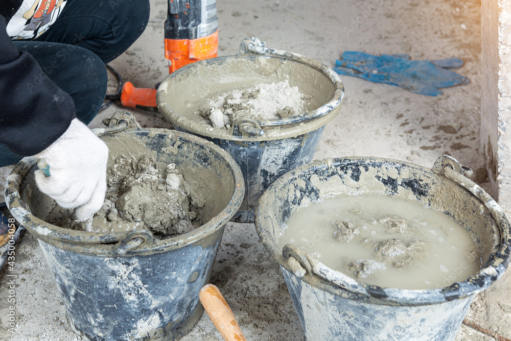 Plastic buckets for transport of cement at construction, cement mixing ...