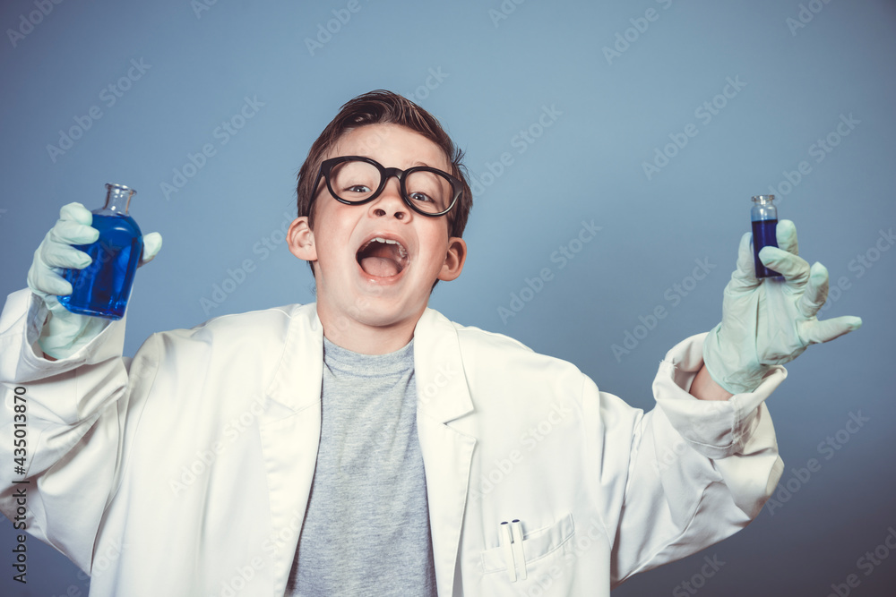 cool school boy with thick black glasses is dressed as scientist with ...
