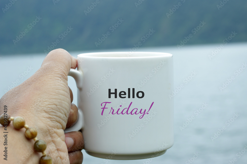 Friday coffee. Hello Friday greeting text on a white cup of coffee or ...