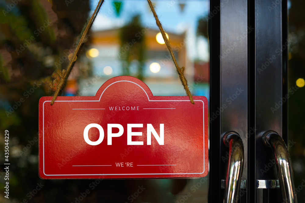red label open closed sign on glass door is open for welcome customers ...