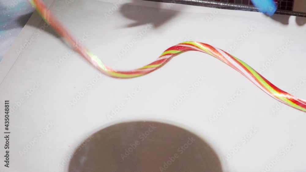 Vídeo do Stock: Confectioners making candies from melted colored sugar ...