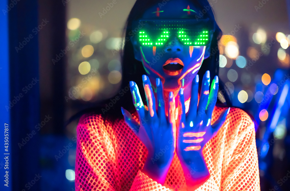 Neon asian woman dancing. Fashion model woman in neon light, portrait ...