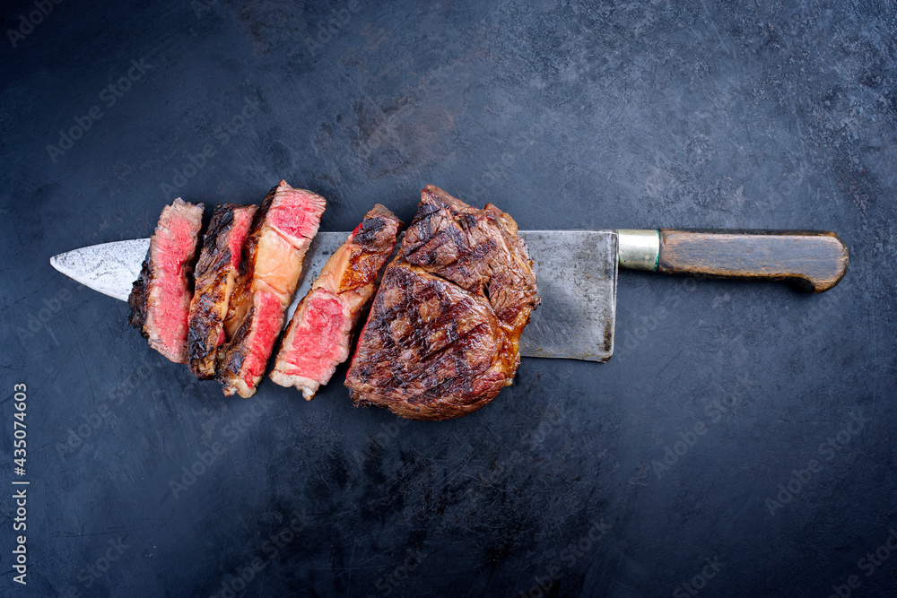 Traditional barbecue dry aged wagyu rib-eye beef steaks sliced and ...