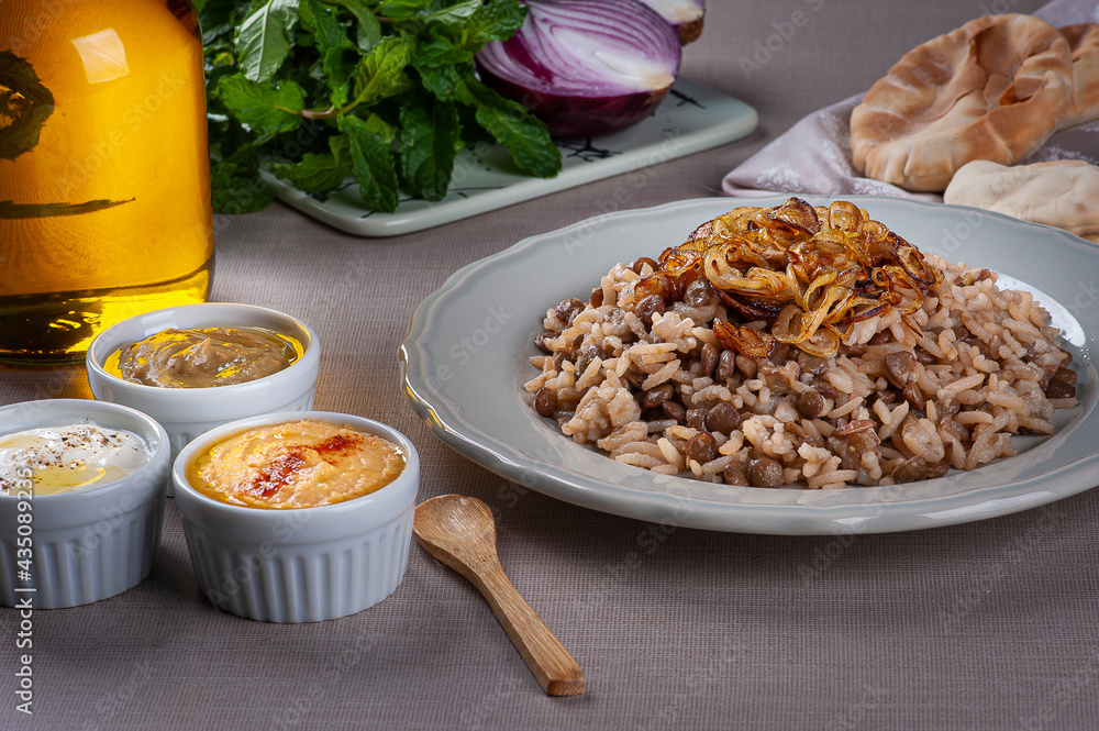 Mujaddara. Rice with lentil a vegetarian dish of Arabic cuisine. Stock ...