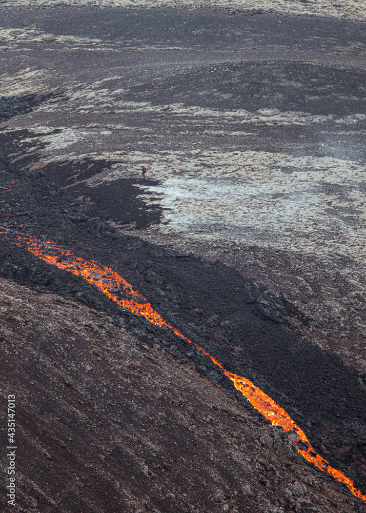 Lava escaping the lava wall and flowing into a valley in Iceland. Stock ...