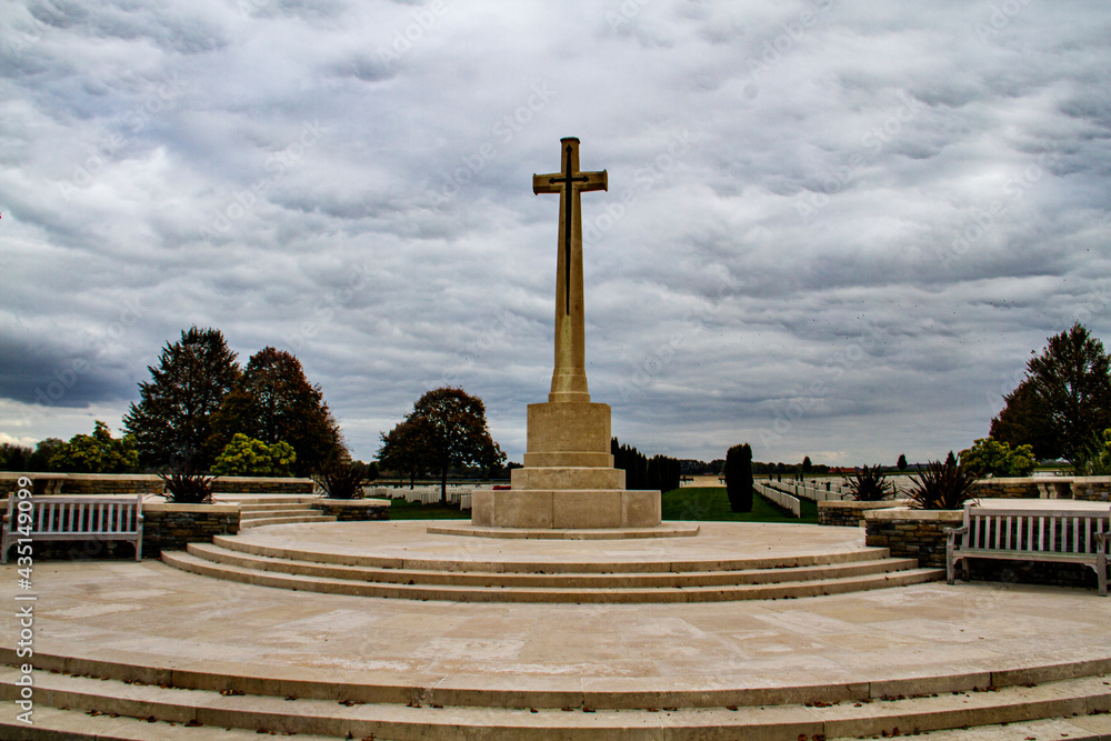 In Flanders Fields, the poppies blow Between the crosses, row on row ...