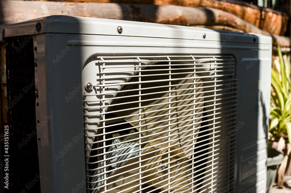Closeup of a Split Type Inverter Air conditionier condenser outside a ...