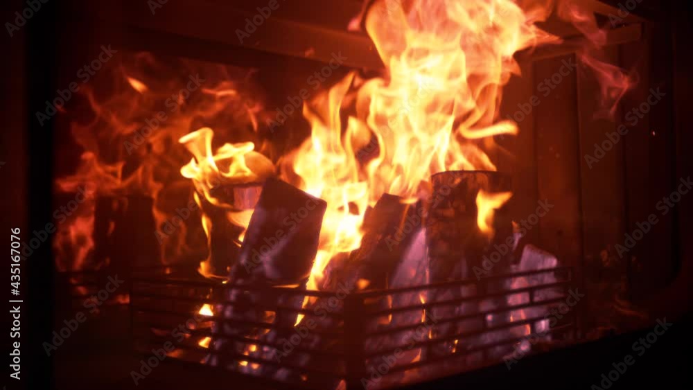 Stockvideon SLOW MOTION CLOSE UP: Large fire burns inside a fire pit in ...