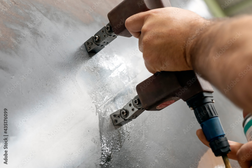 The inspector is testing with magnetic particle inspection method to ...