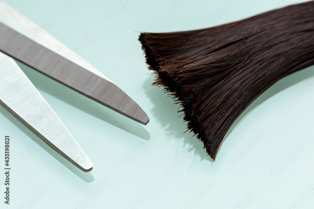 wet hair after being cut with scissors, haircut at barber shop or salon ...