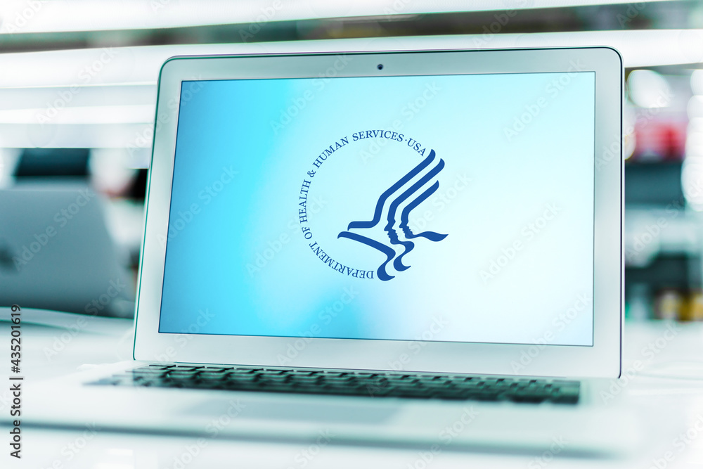 Laptop computer displaying logo of HHS Stock Photo | Adobe Stock