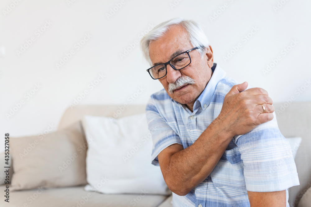 Old senior man with shoulder pain. Upset senior elder man feel sudden ...