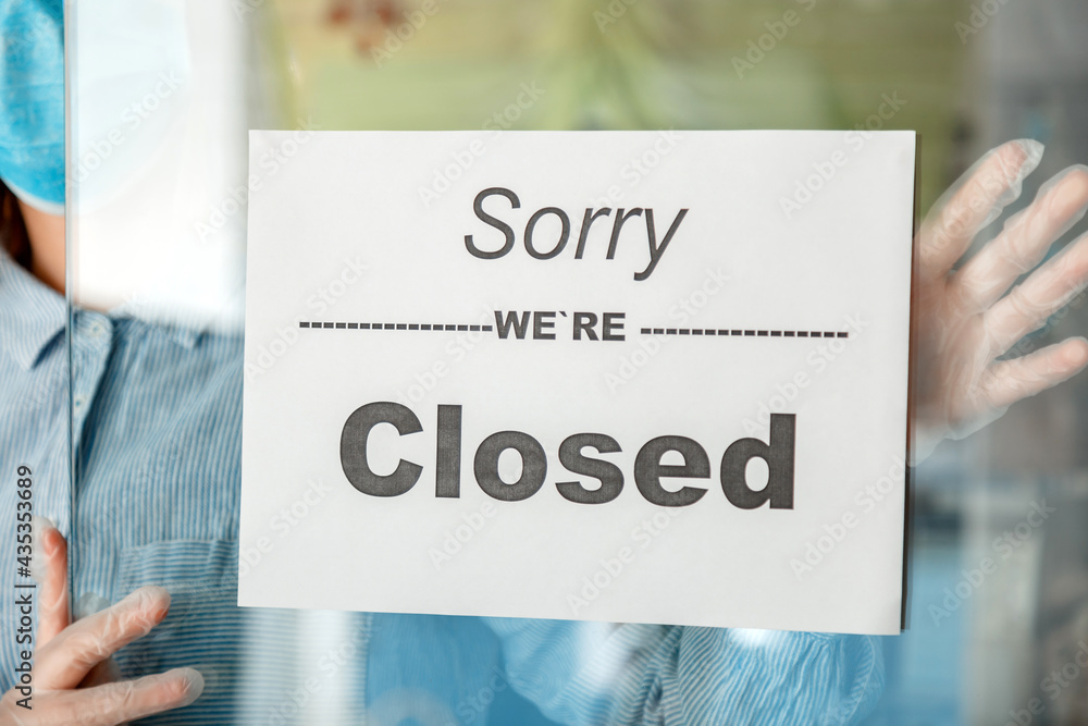 Sign Sorry we re closed on shop entrance door as new normal shutdown ...