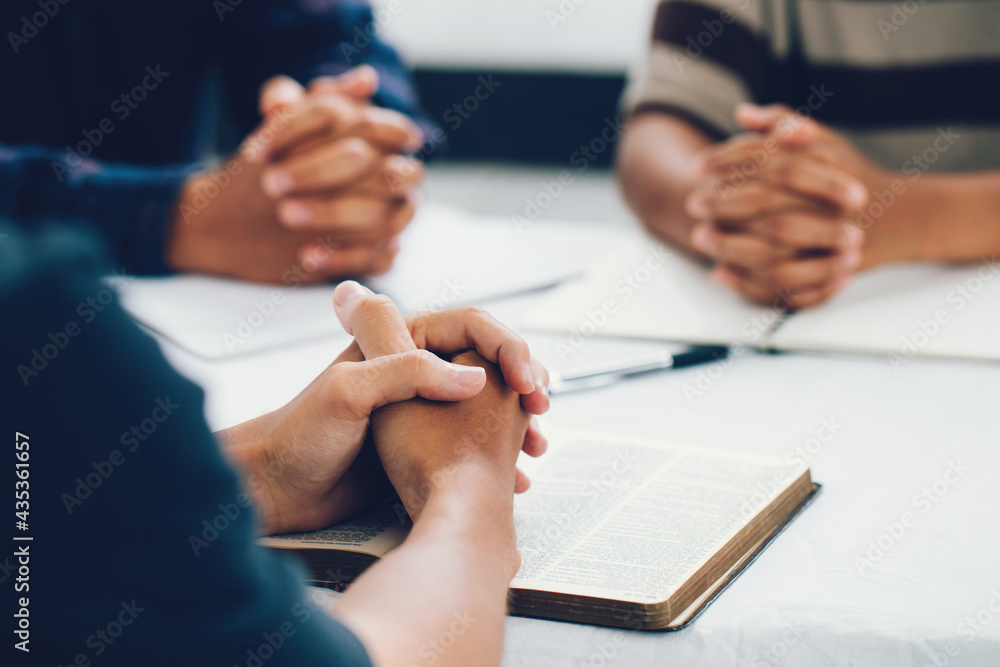 Foto de group of christian are congregants join hands to pray and seek ...