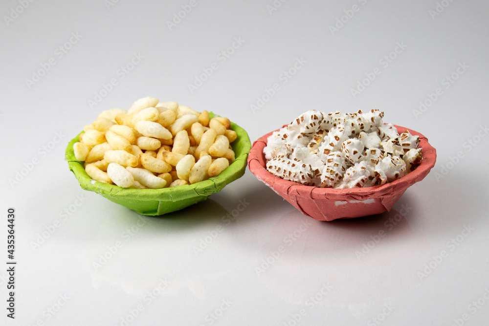 puffed rice and popped rice in green and pink paper bowl. Stock Photo ...