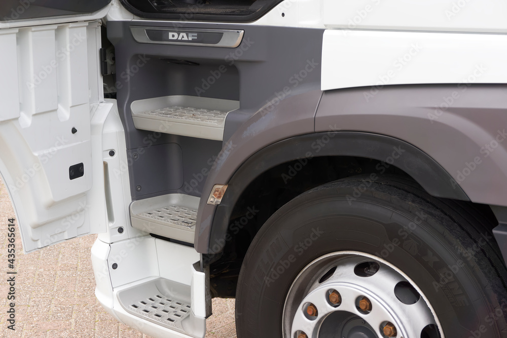 Cabin stairs of a white truck with DAF logo. DAF Trucks is a Dutch ...