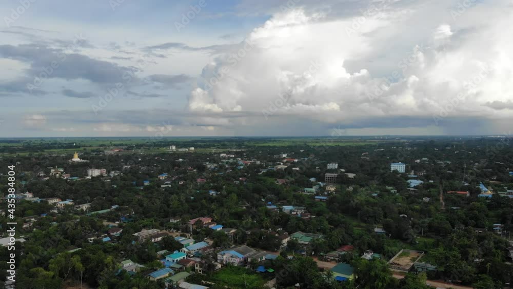 Drone flying over the historical city of Bago in Myanmar. People going ...