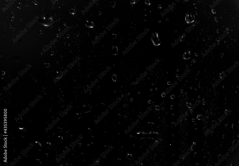 water drops on black background. abstract dew water droplets on a ...