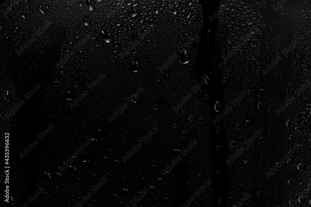 water drops on black background. abstract dew water droplets on a ...