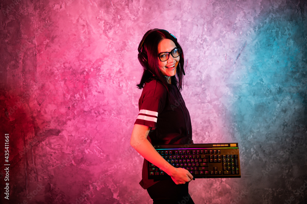 Professional Girl Gamer in MMORPG Strategy Video Game. She's She posing ...