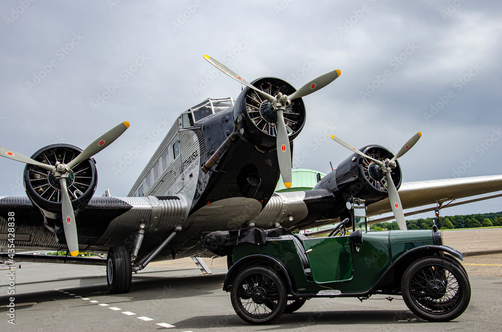 The historical plane "Tante Ju" Junkers Ju 52 on a cloudy day with an ...