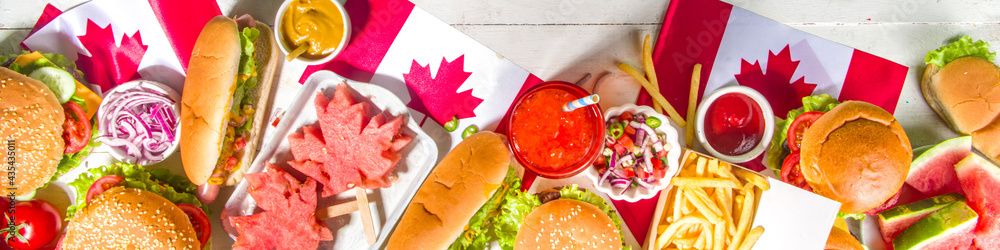 Set of various Canada Day bbq food. Picnic party table with maple leaf ...