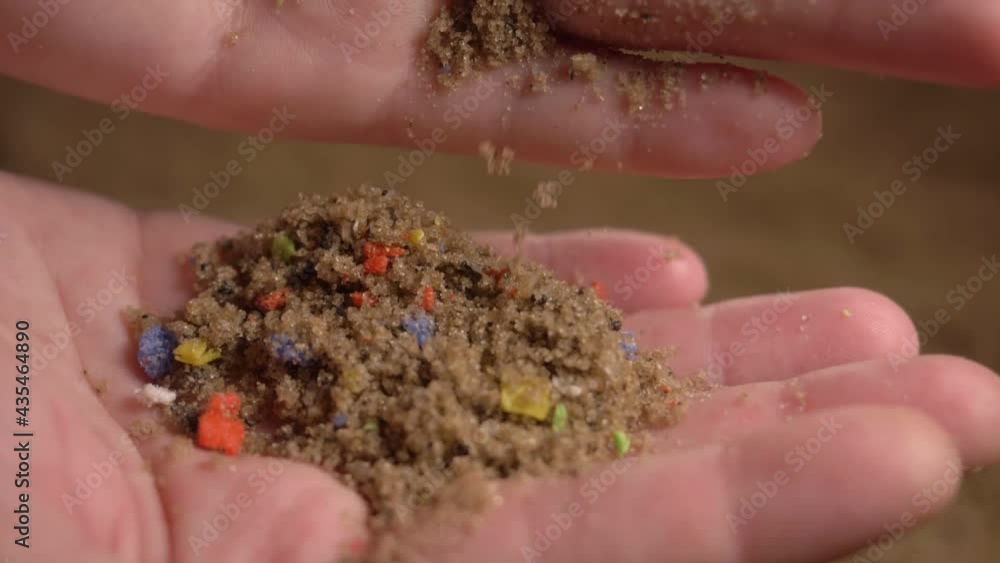 Stockvideo microplastics on sandy beaches, tiny multicolored plastic ...