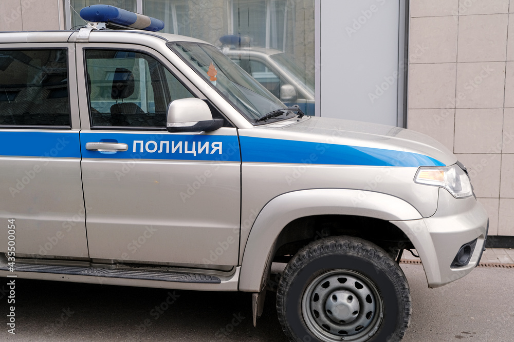 Russian police car. The inscription on the car door is made in Russian ...