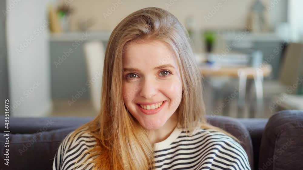 Head and shoulders portrait of beautiful shy young woman with green ...