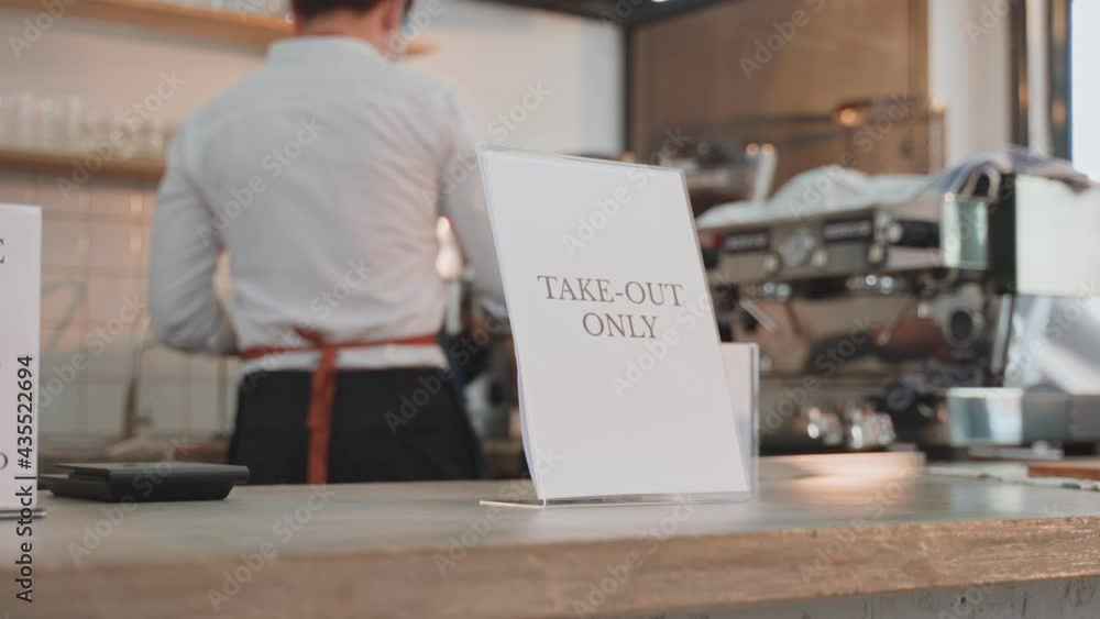 Asian cafe owner put Take Out Only announcement sign on counter bar ...