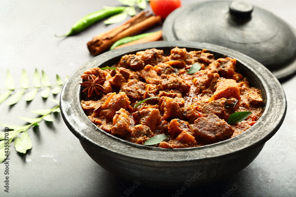 Traditional cooking- Indian mutton curry cooked in clay pot .earthen ...