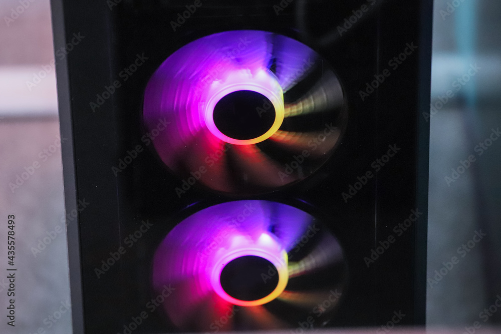 Pink illumination of a cooler PC system unit. Computer fan with LED ...