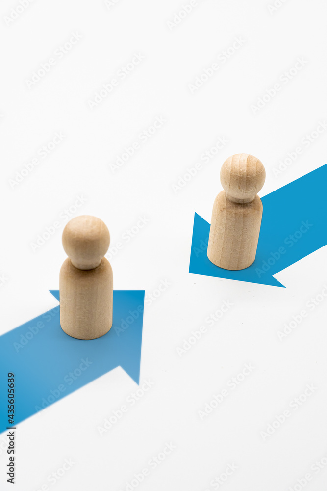 Wooden human arrow with joint venture arrow. Concept of team work ...