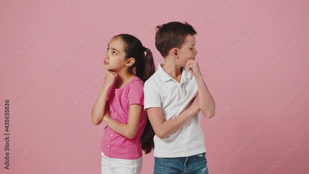 Thinking process. Studio portrait of pensive little boy and girl ...