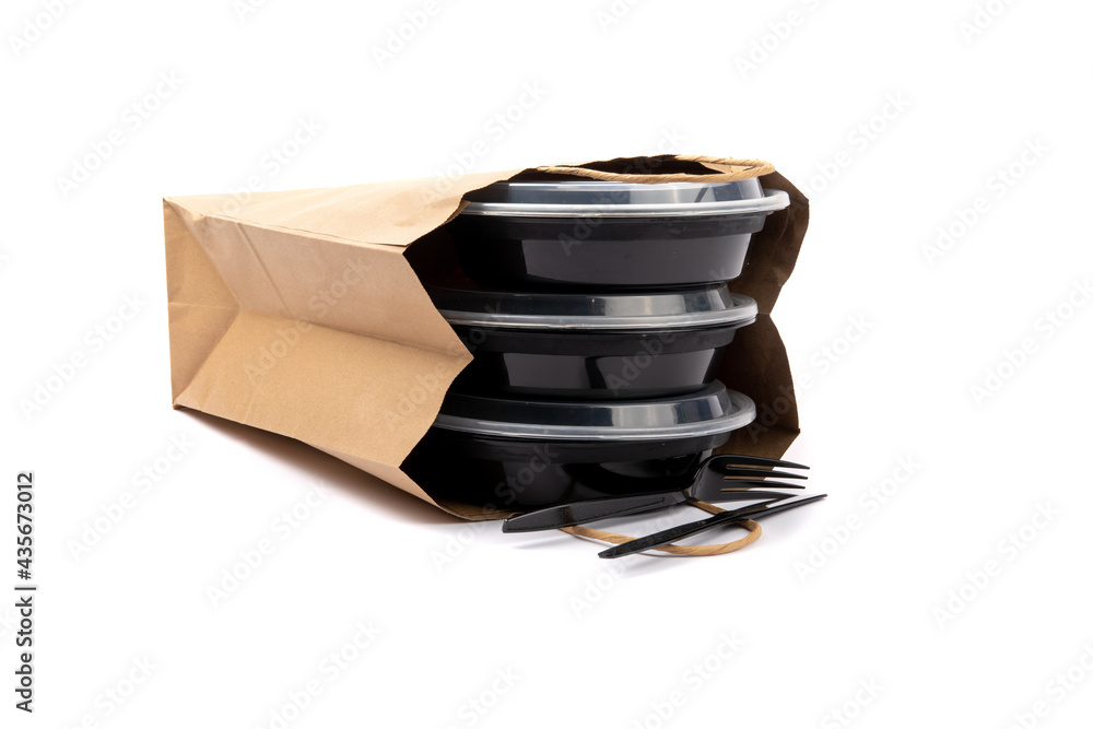 plastic food delivery containers inside a Kraft paper bag used by food ...