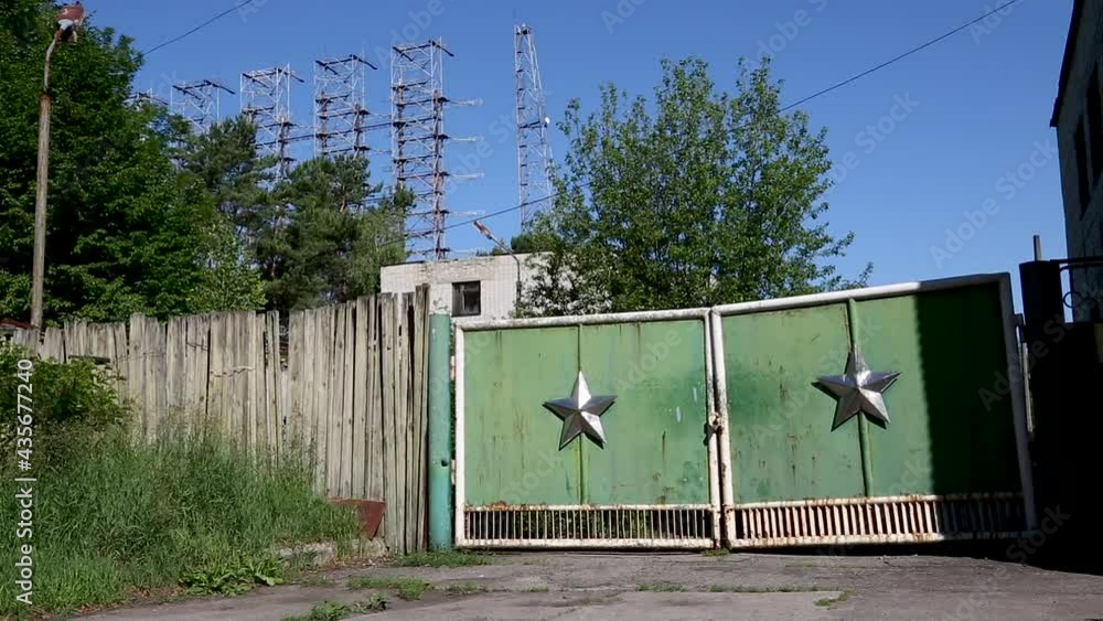Green gate with Soviet stars. Secret military facility in Chernobyl ...