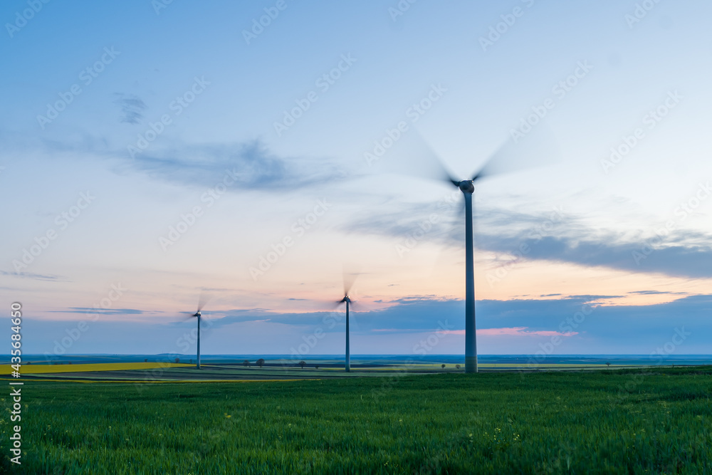 Dramatic landscape of wind power stations in a wind farm with ...