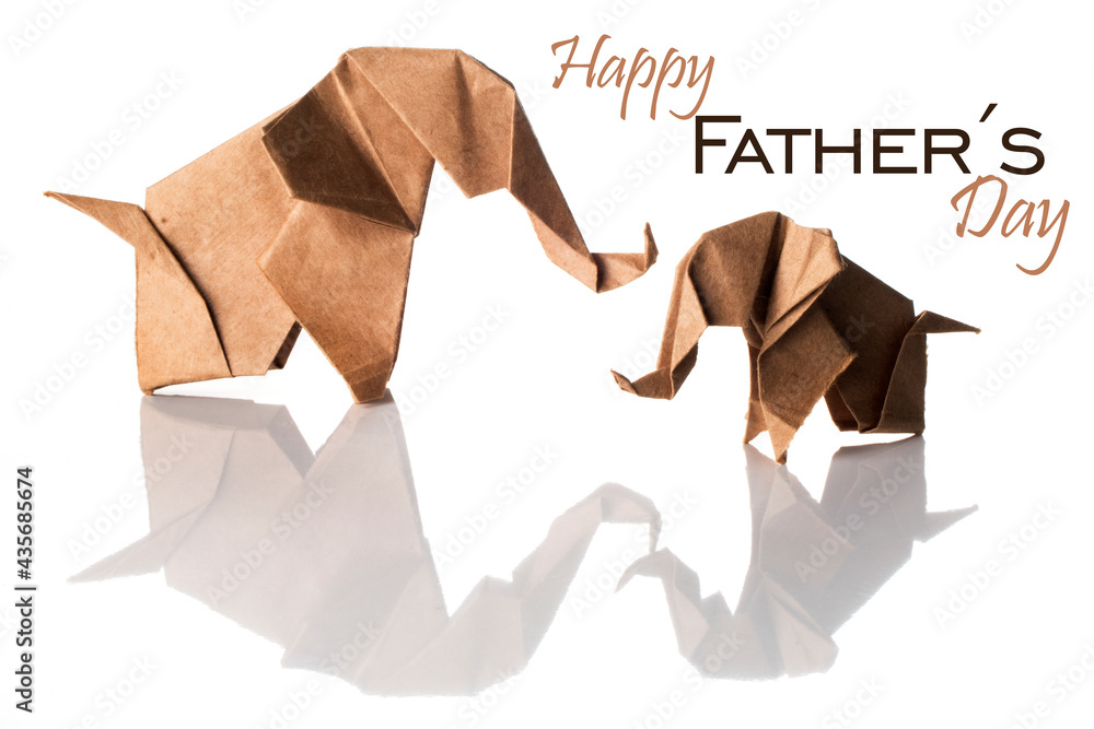 Fathers day message made with origami elephants over white background ...