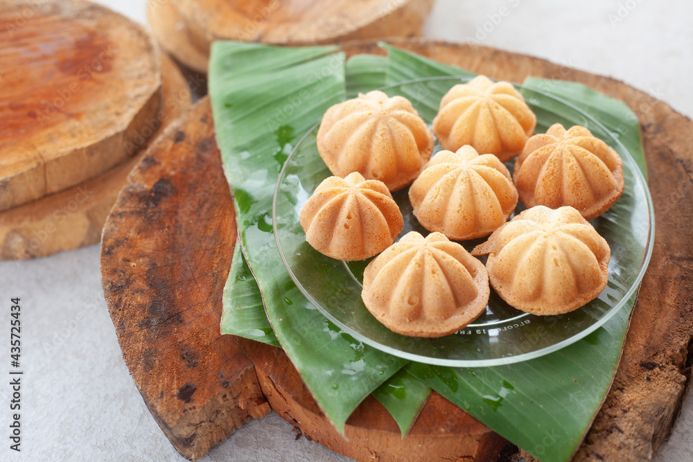 Sponge cake baked in special aluminium moulds also called Kueh Bolu or ...