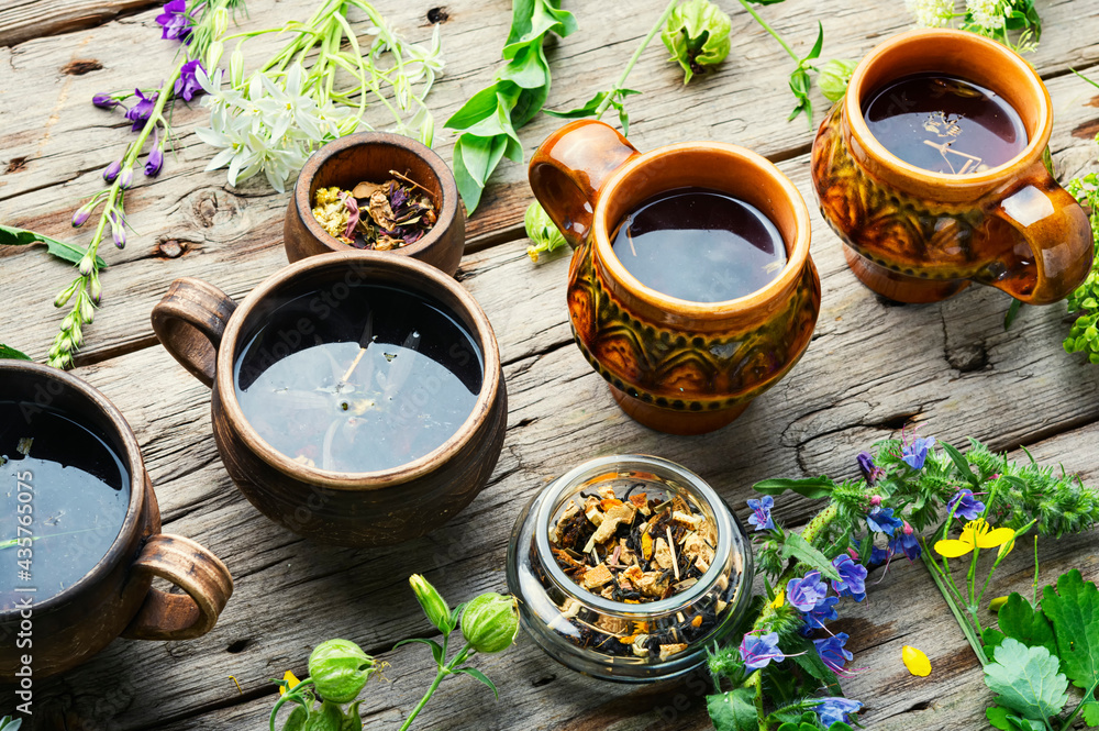 Mugs of herbal tea with various herbs Stock Photo | Adobe Stock