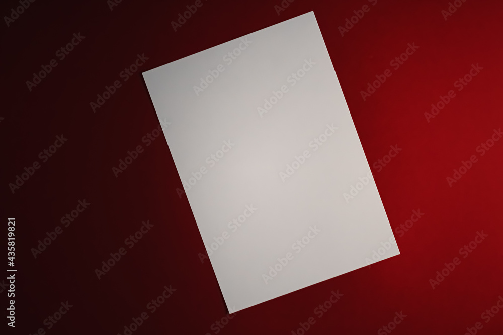 Blank A4 paper, white on red background as office stationery flatlay ...