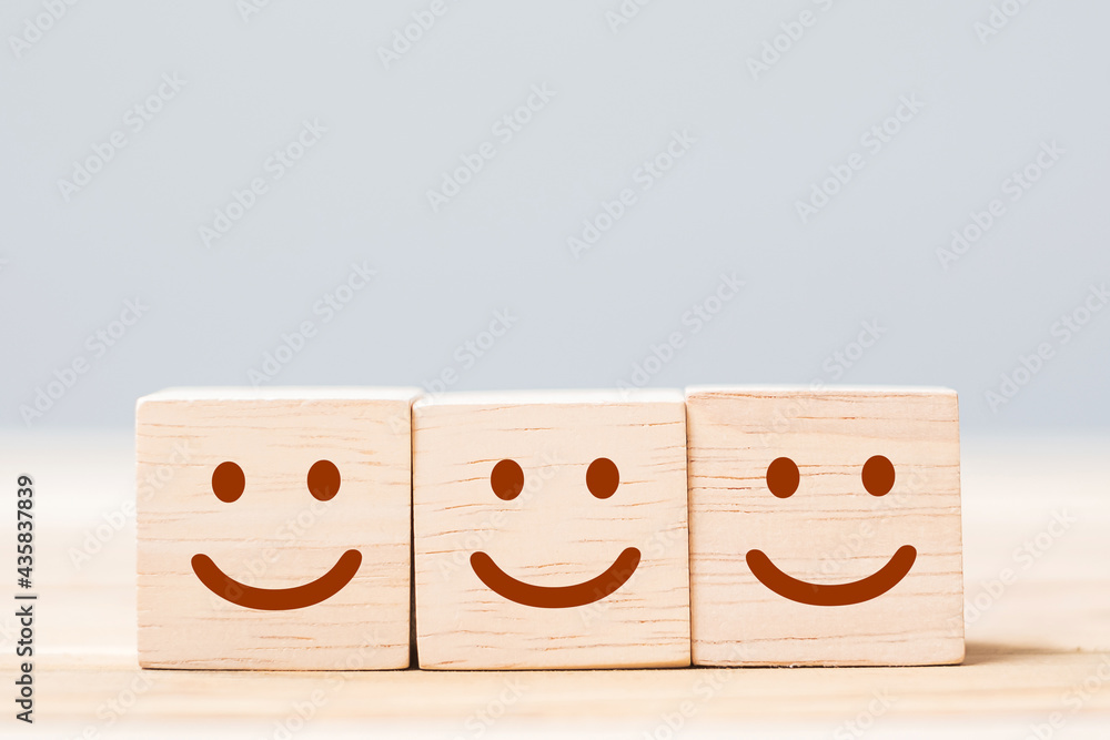 smile face symbol on wooden cube blocks. Emotion, Service rating ...