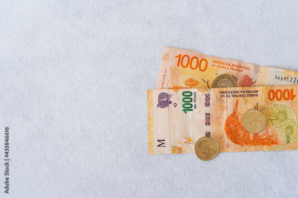 Bills of $1000 argentine pesos with white background. One thousand in ...
