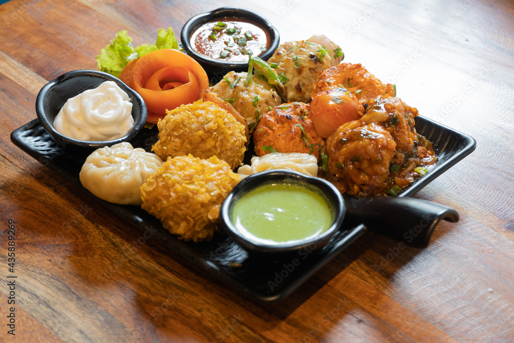 tandoori fried roasted momos dimsum pakora with vegetable flower ...
