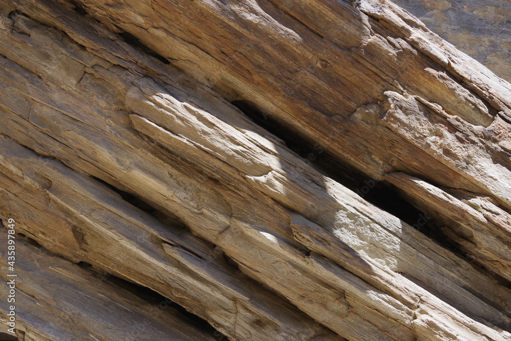 Rock formation of layered stone showing the shifting of earth plates in ...